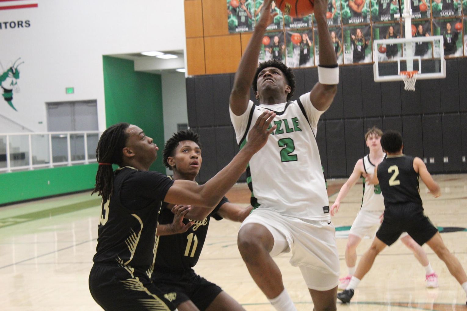 Late heroics lift Hornets; Ladies split busy district week